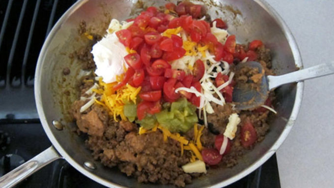 Taco Dip in a Football Bread Bowl Recipe - Tablespoon.com